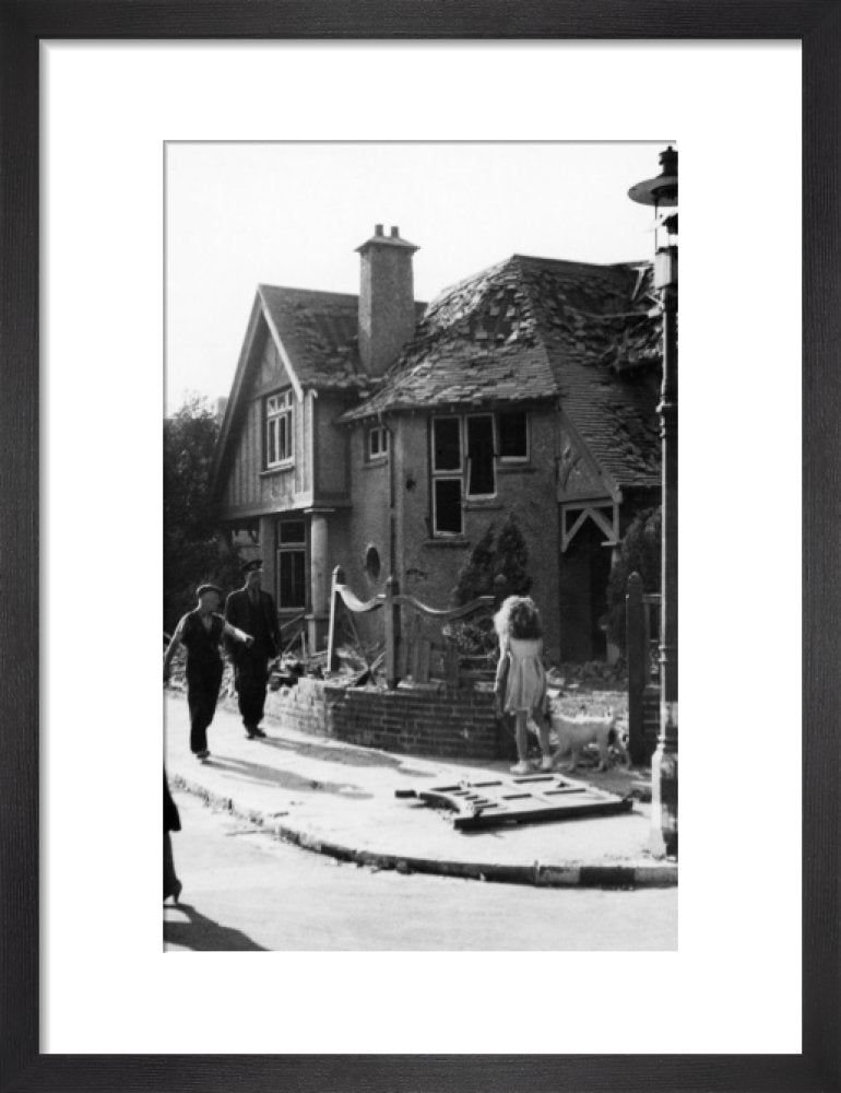 A bomb-damaged house in Gosport after a German air raid on 12 August 1 ...