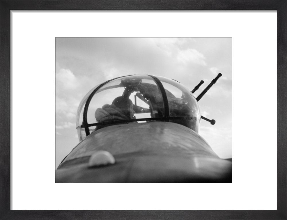 A No. 57 Squadron Lancaster mid-upper gunner in his turret, February 1 ...