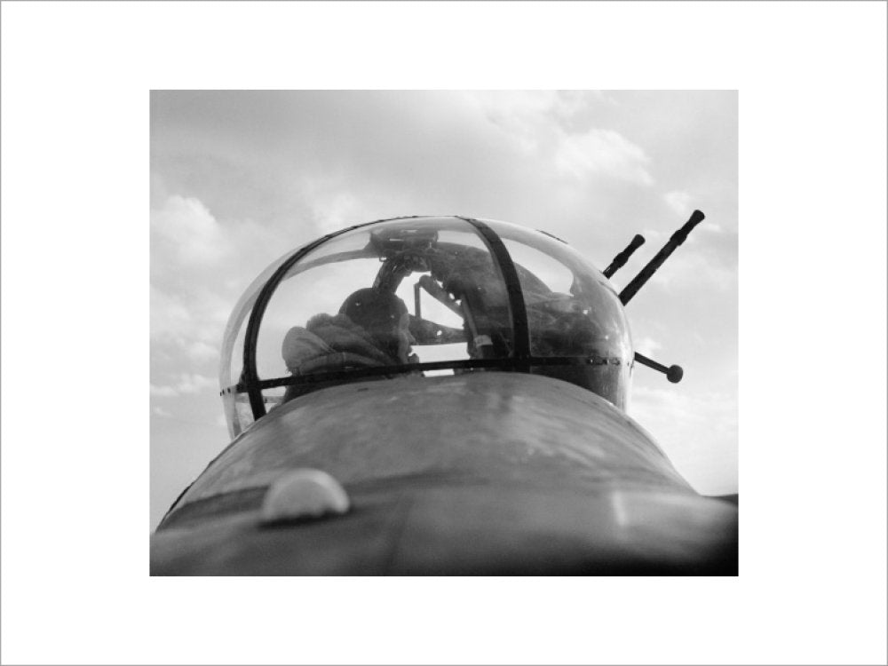 A No. 57 Squadron Lancaster mid-upper gunner in his turret, February 1 ...
