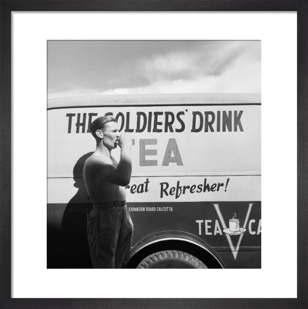 Cecil Beaton photograph of a British soldier drinking tea next to a Re ...