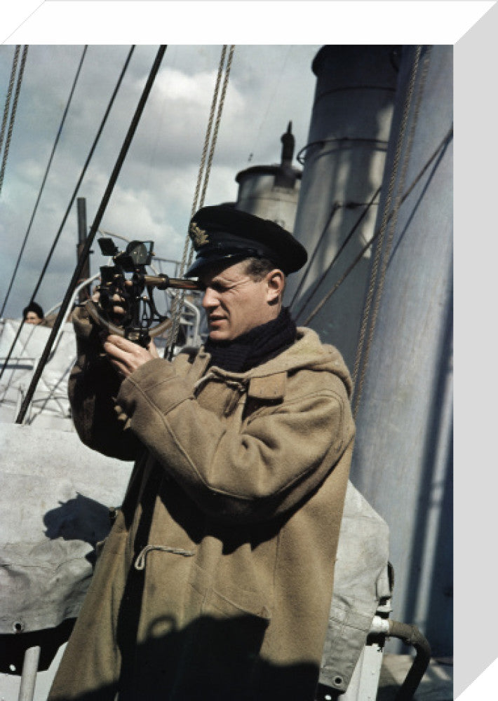 A Royal Navy officer using a sextant aboard a destroyer on convoy prot ...